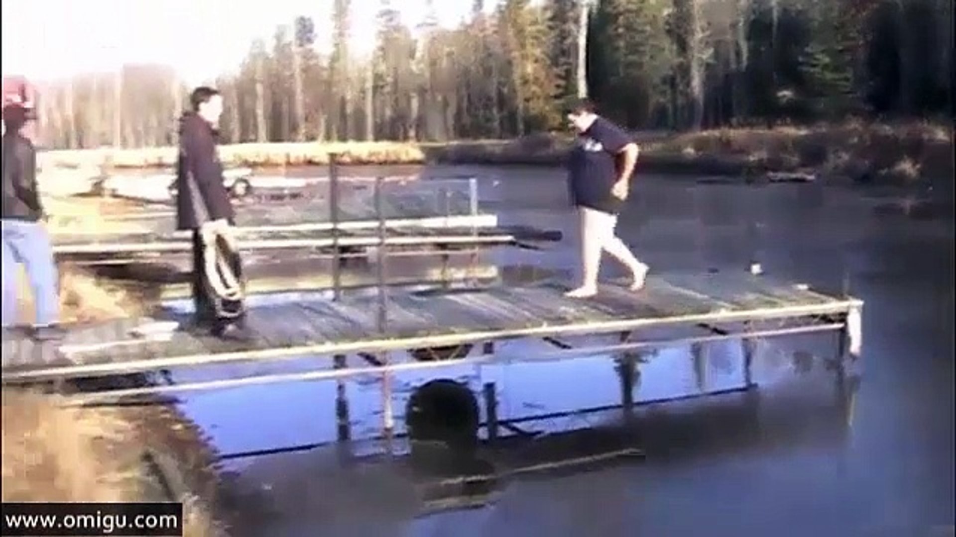 Fat Guy Jumps Through Ice
