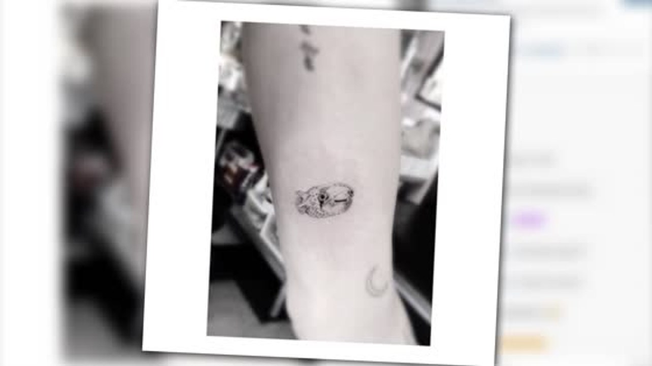 Miley Cyrus Immortalizes Her Late Puffer Fish in Ink On Her Arm - video ...