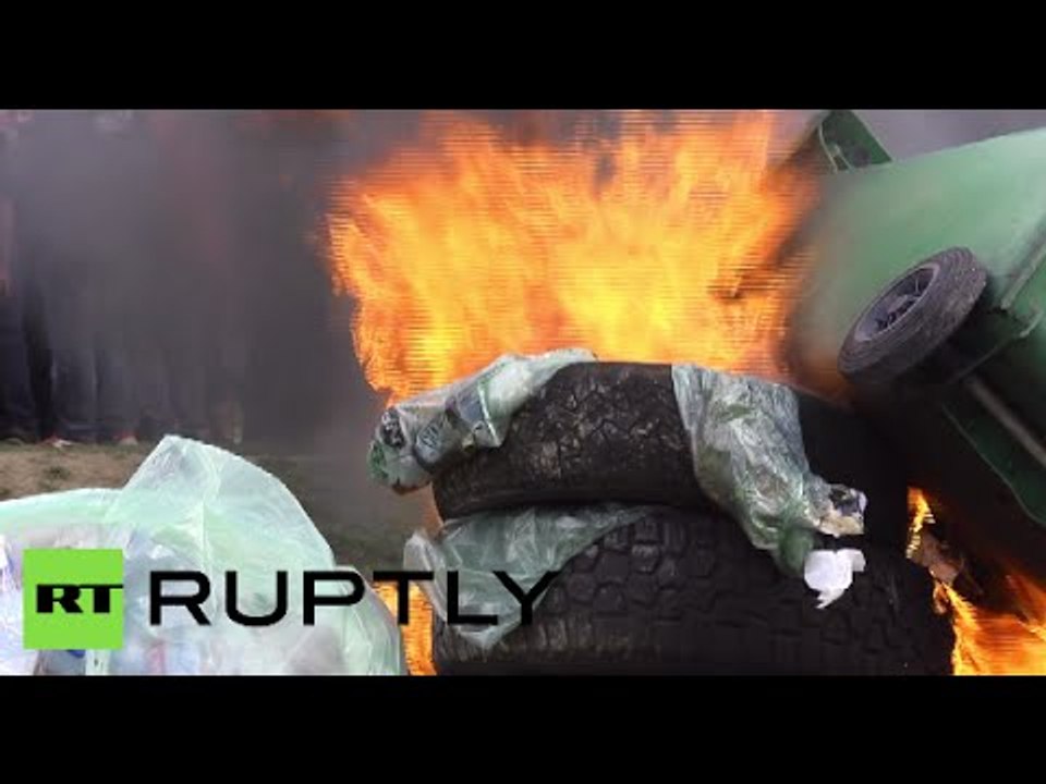 French farmers set trash on fire in central Paris, demanding fair ...
