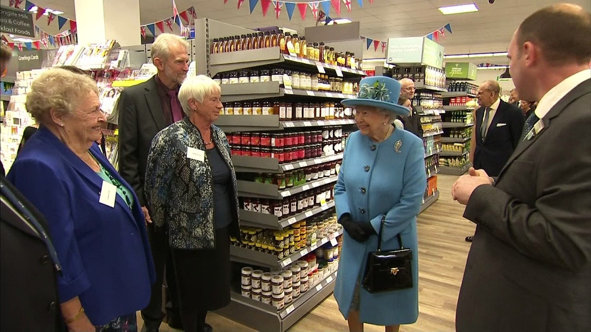Queen Elizabeth Visits Poundbury Supermarket In Bright