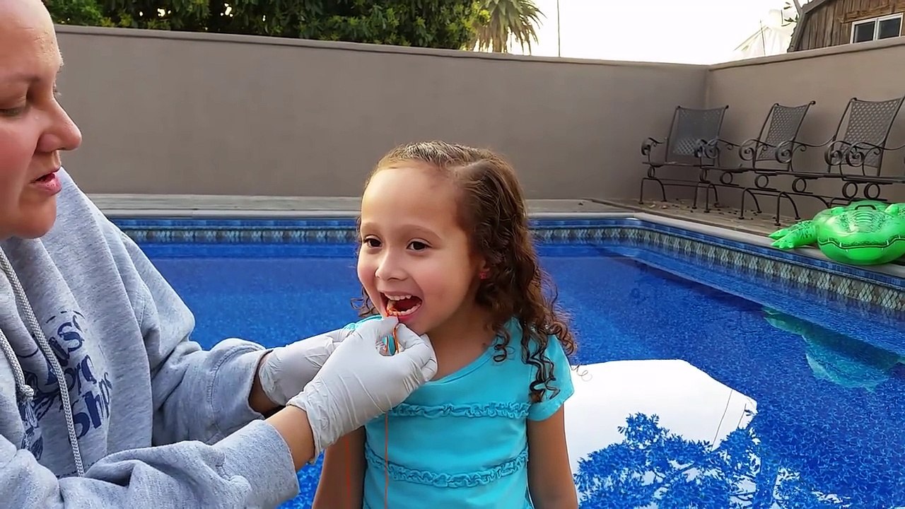 Pulling out Kaylies 1st loose tooth. How to pull out a loose tooth with ...