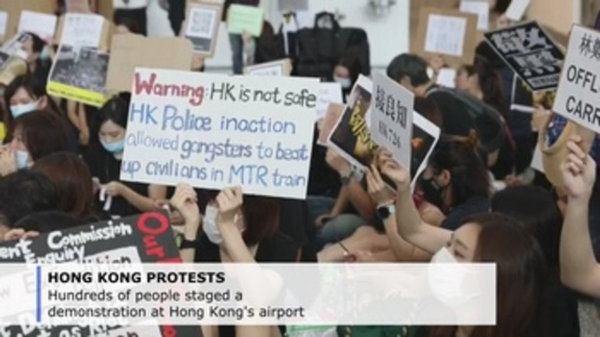 Watch Hong Kong demonstrators pack airport, sing protest song from 'Les ...