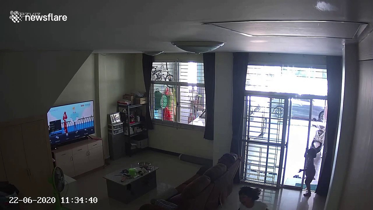 Toddler runs through glass door smashing it into pieces while neighbour ...