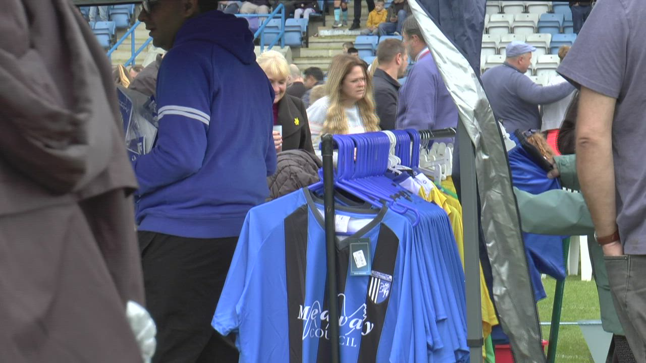 Gillingham fans pack the Priestfield pitch to meet the players at ...