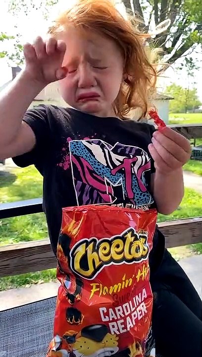 Grimacing Girl Says She Likes Spicy Cheetos - video Dailymotion