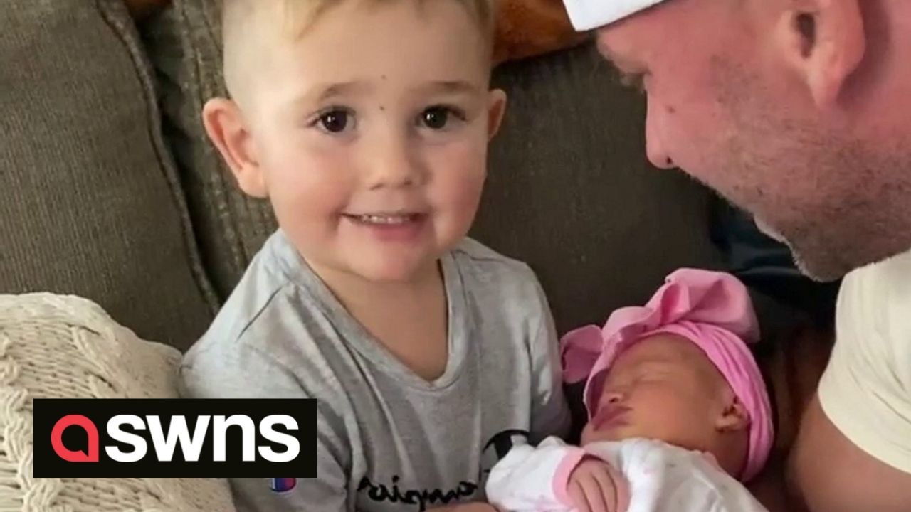 Adorable moment toddler meets baby sister for the first time and ...