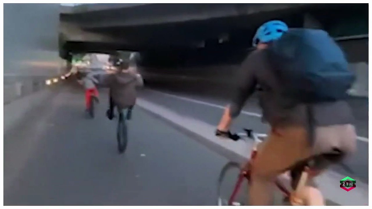 Shocking Moment Cyclist Tries To Shove Rider Pulling A Wheelie Out Of