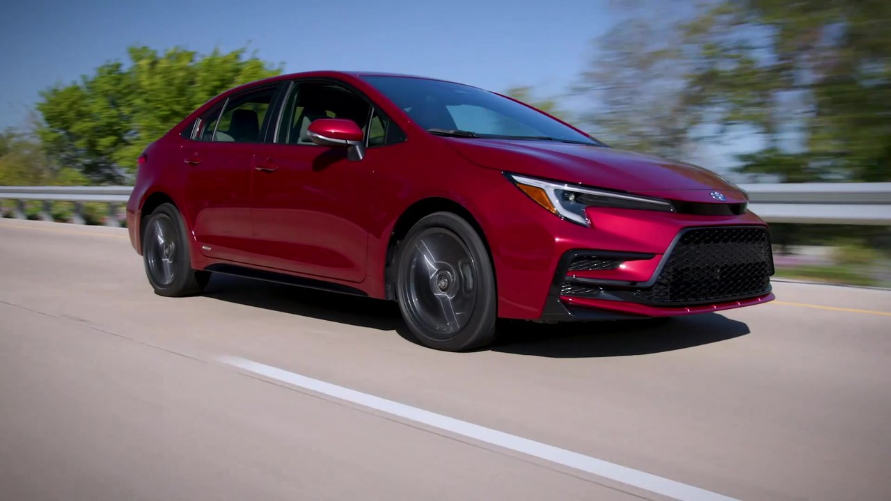 2023 Toyota Corolla SE Hybrid in Ruby Flare Pearl Driving Video - video ...