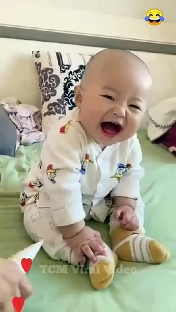 Laughing Baby Falls Gif