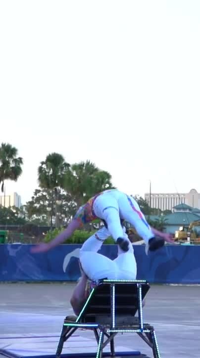 Artist Performs Multiple Flips While Balancing Atop Another Person ...