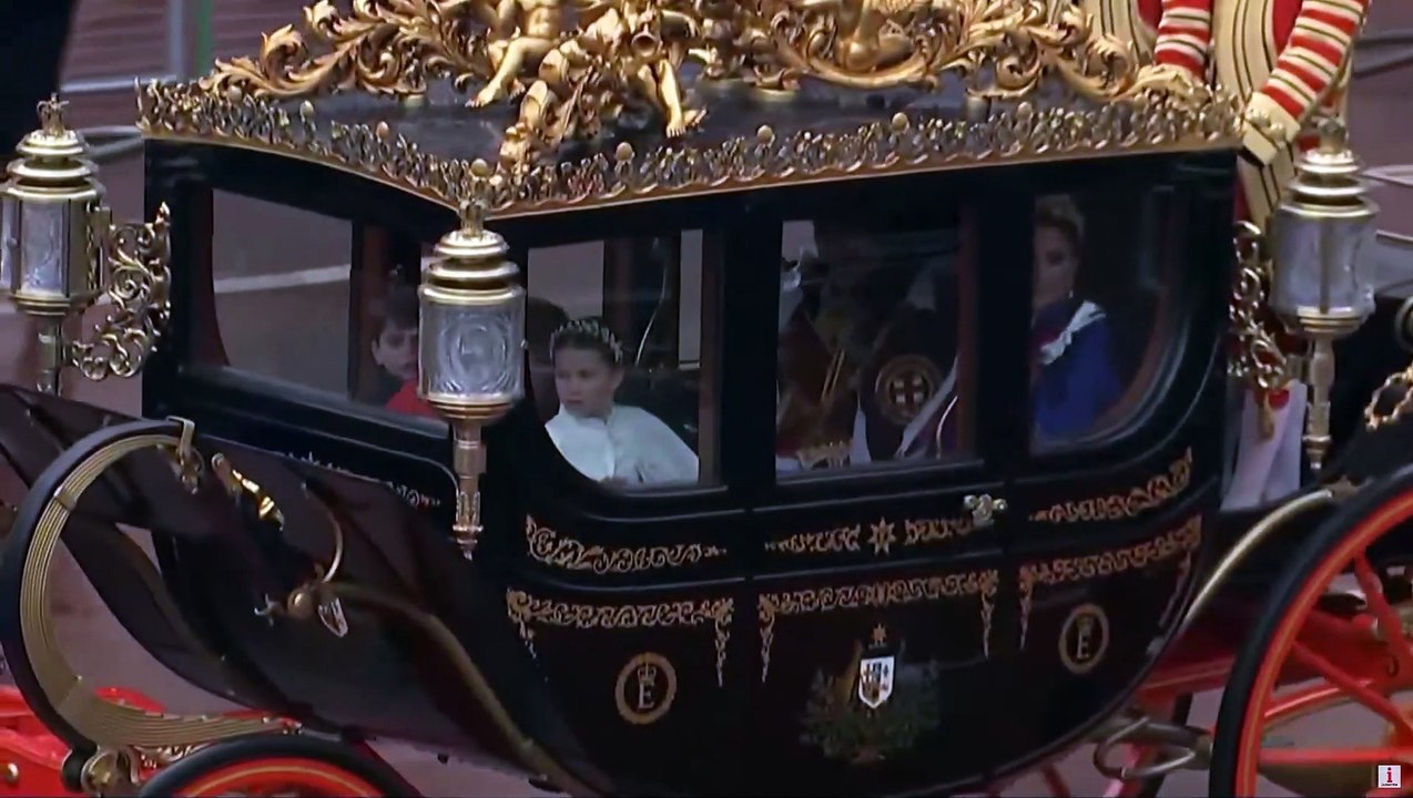Prince and Princesses wave from carriage during coronation procession ...
