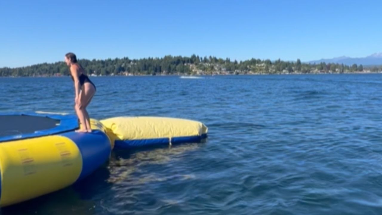 Daring woman's first-ever backflip turns into a back-first splash into ...