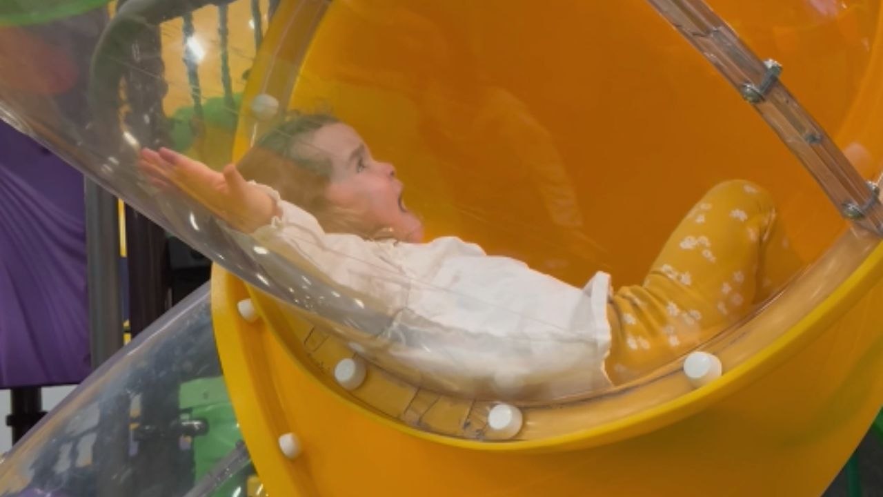 Frightened toddler cries after thinking she's stuck in the slide ...