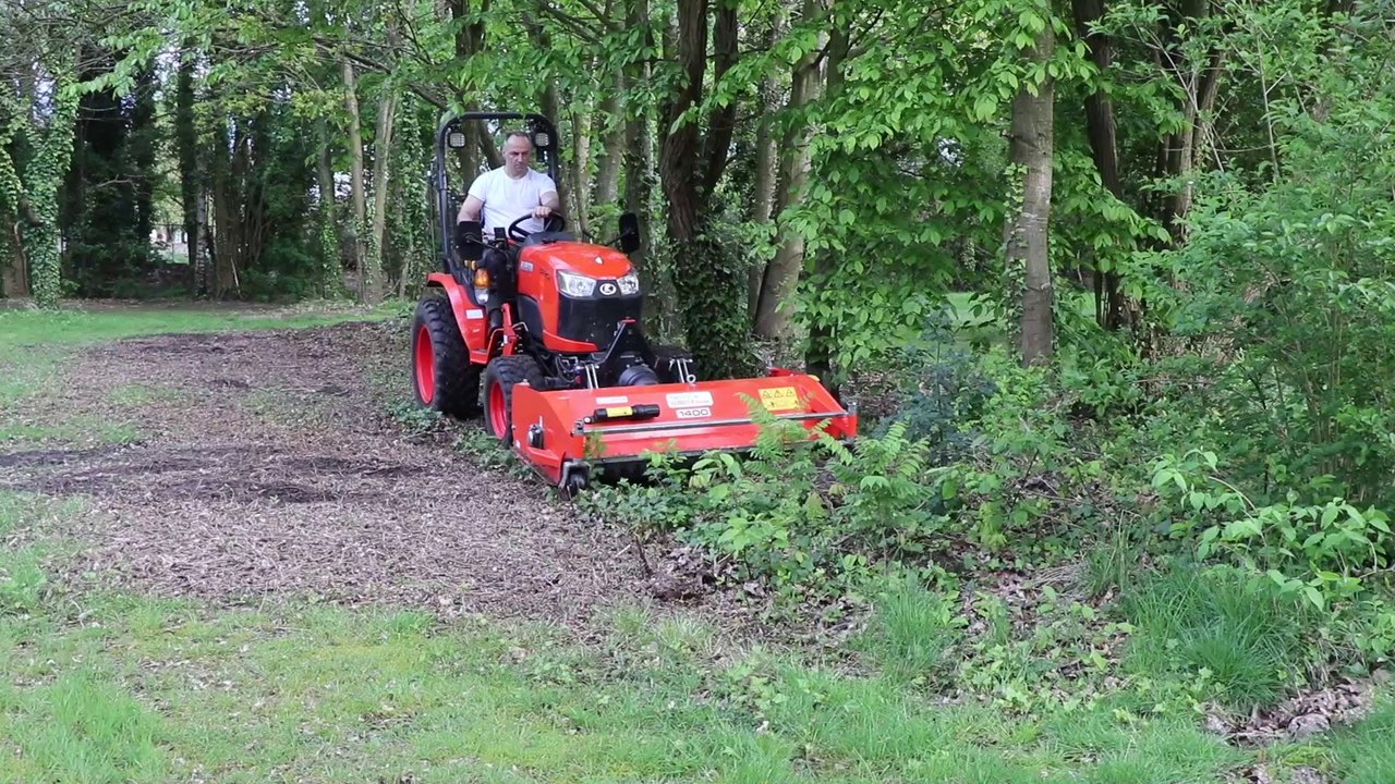 Outdoors clean up using a Kubota B2261 Compact Tractor and Front Flail ...