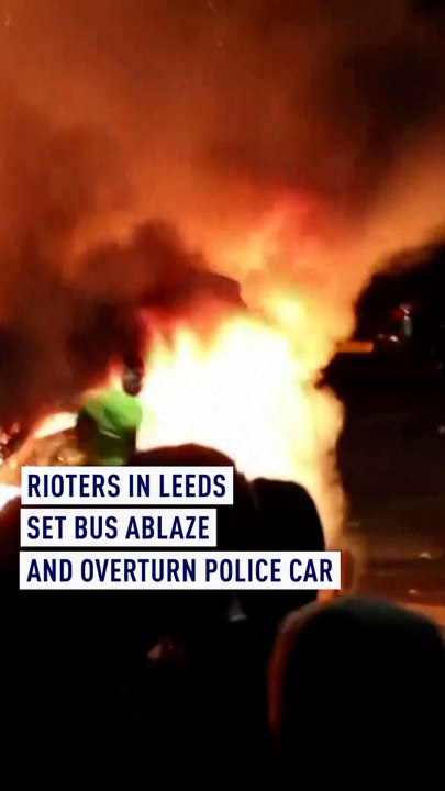 Police car flipped over and bus on fire in Leeds as riots break out ...