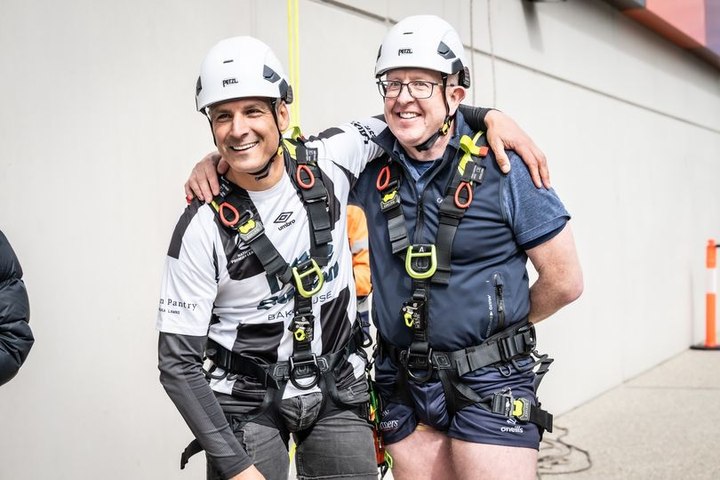 Omar Muscat and Stephen Byron rappel and abseil down a building fir ...