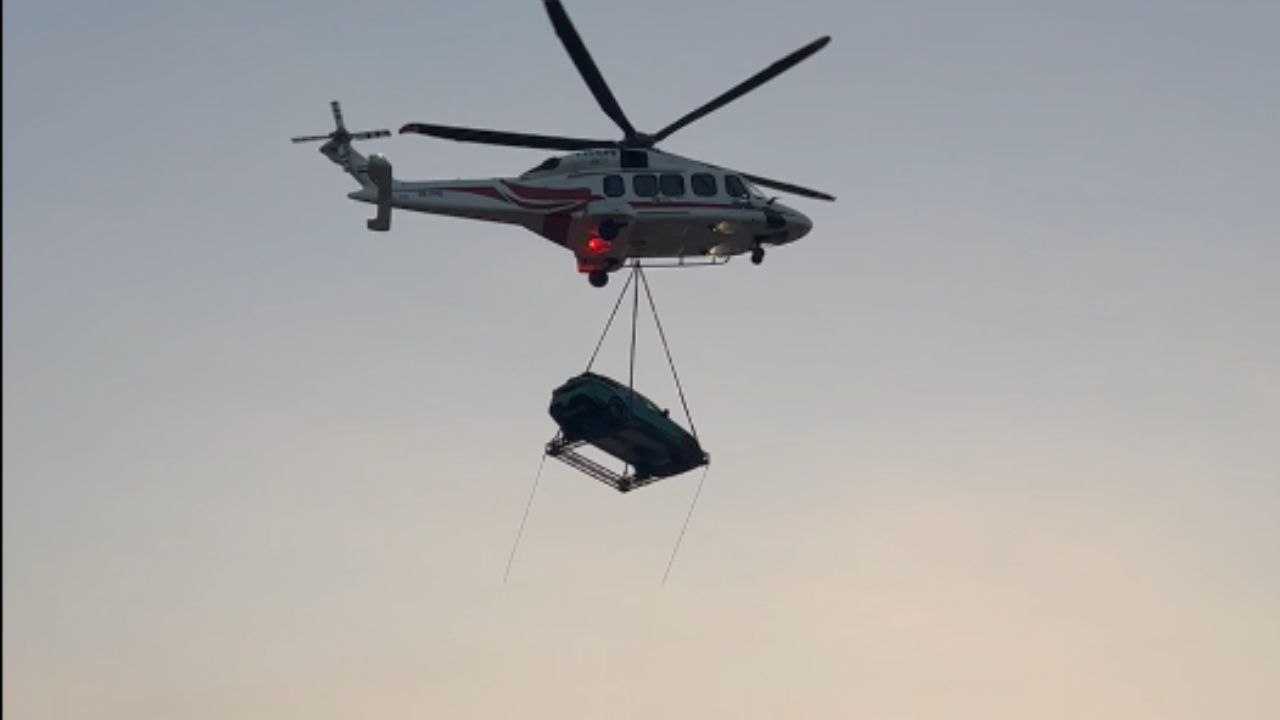 Dubai, UAE: Helicopter carries the all-new BMW M5 Touring to an ...