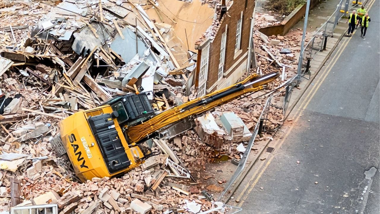 Shocking video shows massive digger crashing onto its side during ...
