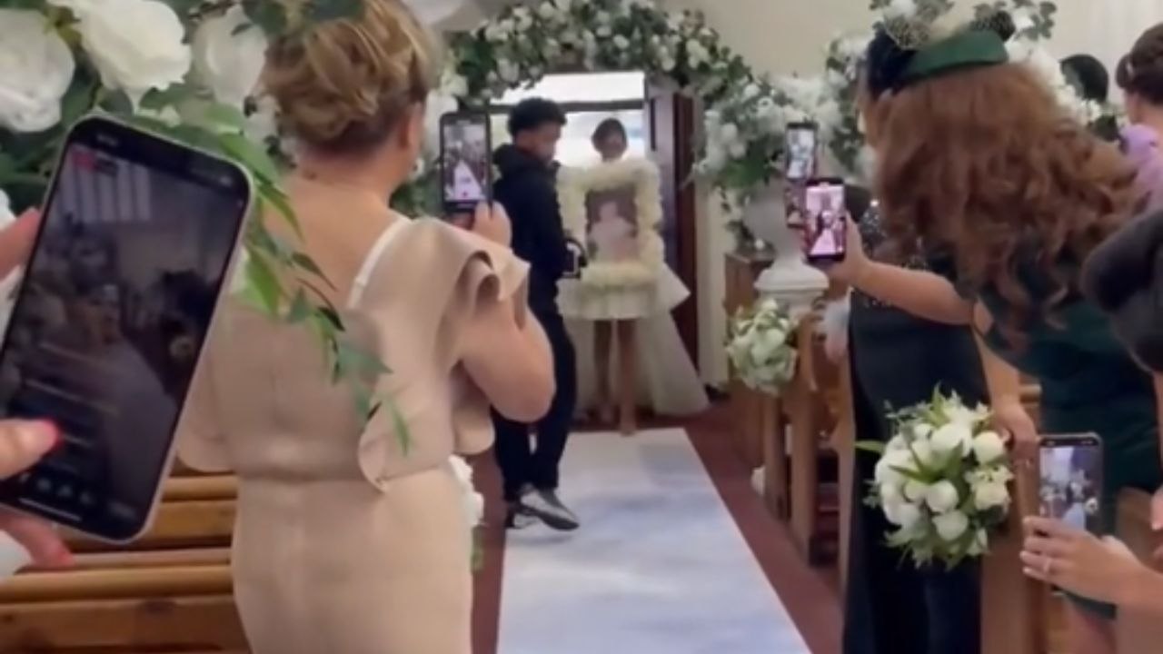 Bride stuns in dreamy gown but aisle is too cramped for a smooth walk ...