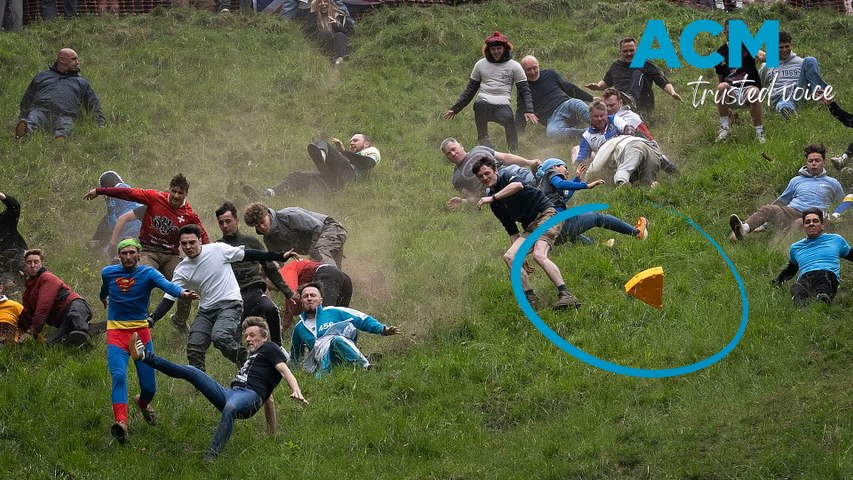 Cheesy chaos: daredevils hurl downhill in wild UK cheese rolling race ...