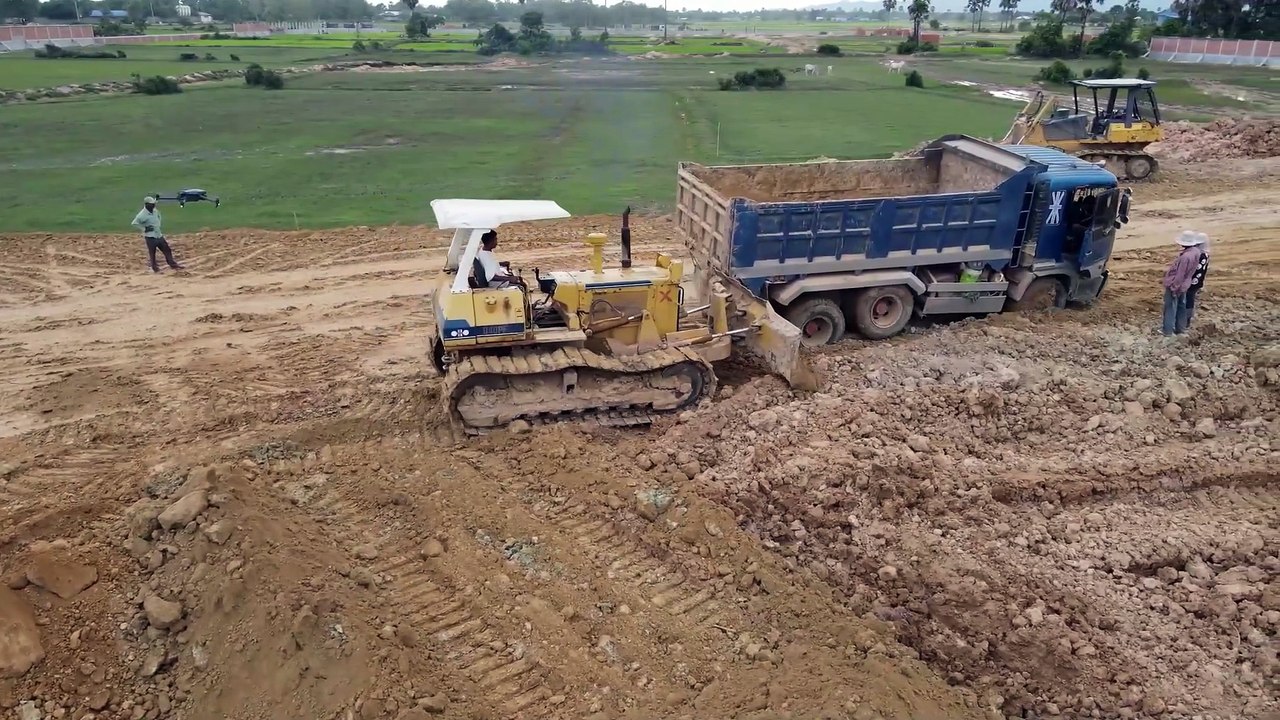 Wow Amazing Action Land Filling by Bulldozer D58 Pushing Soil filling Land with Dump truck ...