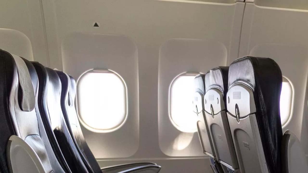 Flight Attendant Explains the Mystery Behind the Black Triangle on Your ...